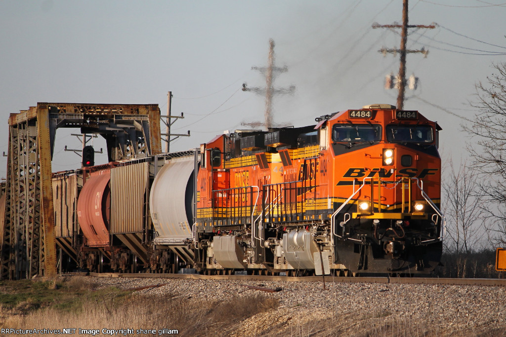 BNSF 4484 leads this grain train sb at elsberry with a new paint job.